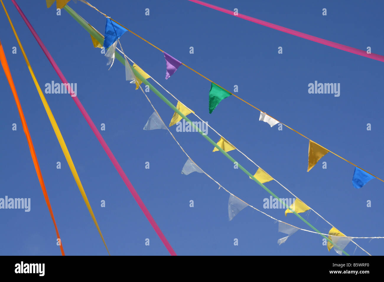 many colourful carnival flags decorations in street party outdoors in ...