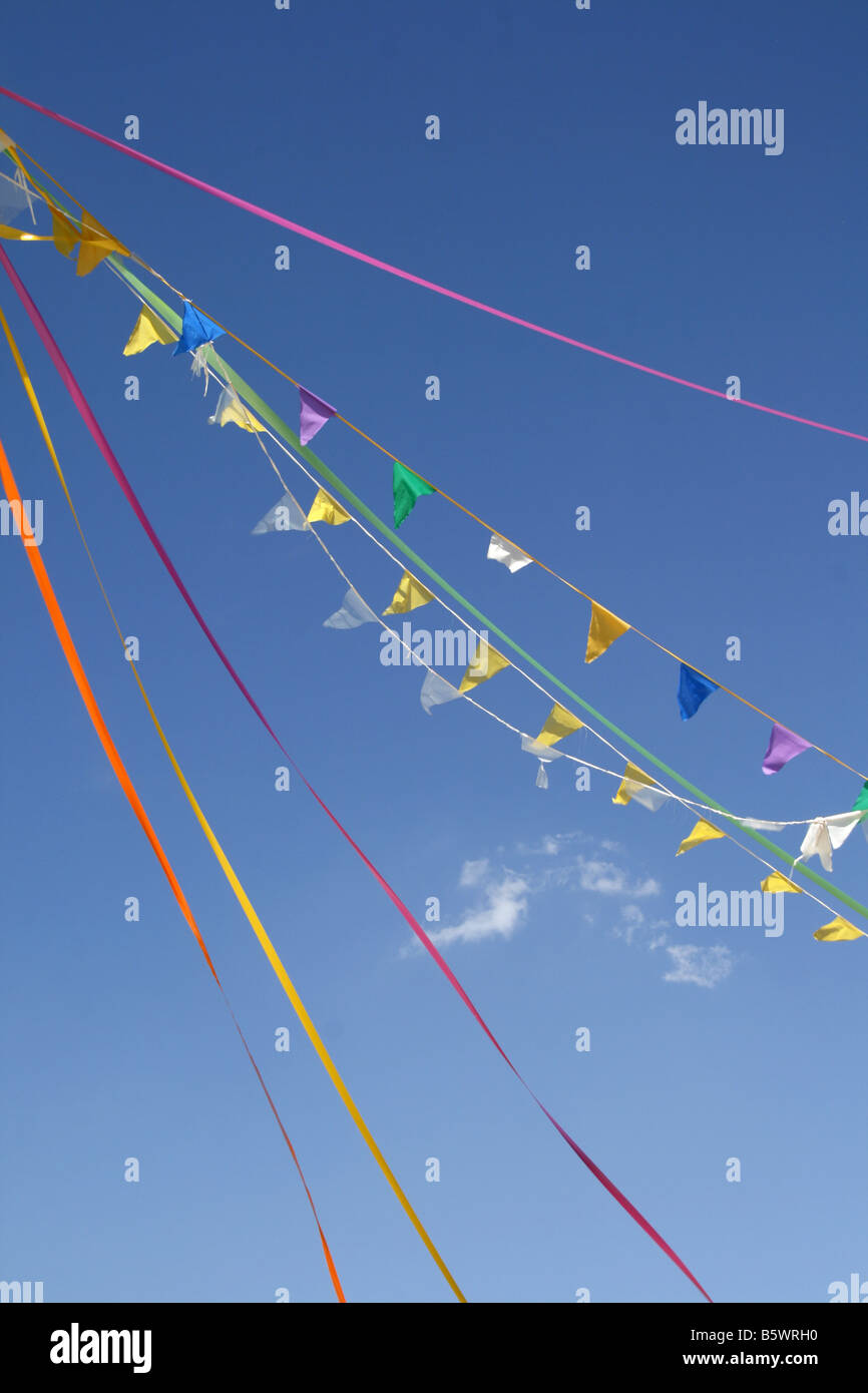 many colourful carnival flags decorations in street party outdoors in ...