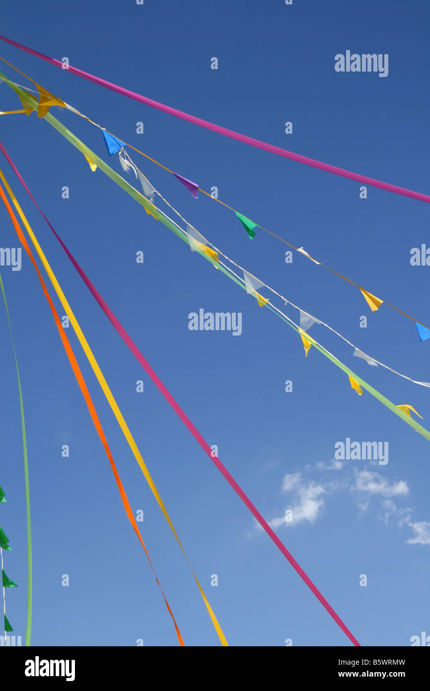 many colourful carnival flags decorations in street party outdoors in ...