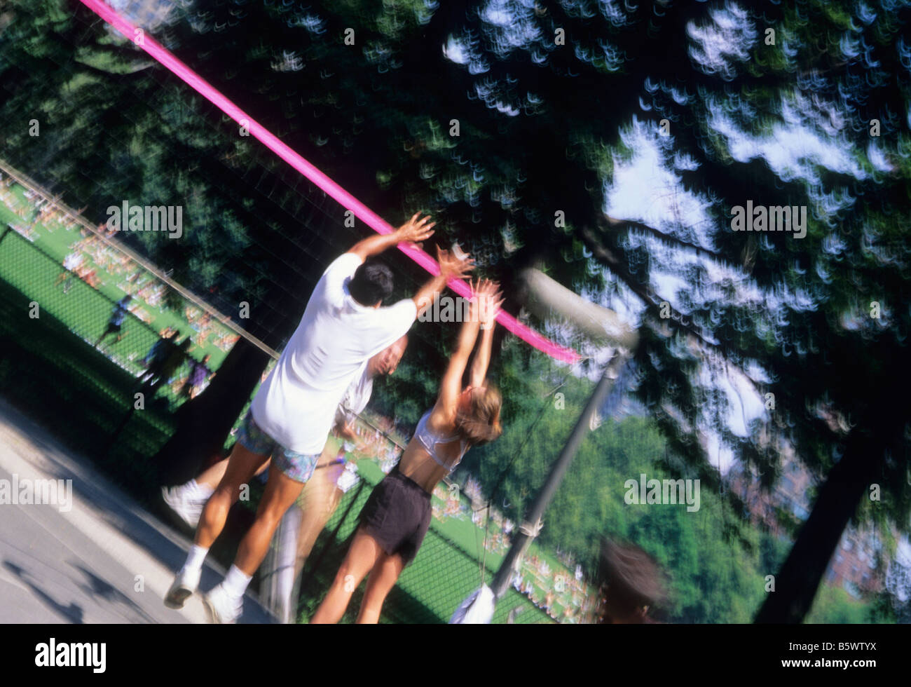 New York City, Central Park volley ball game. Groups of people in the ...