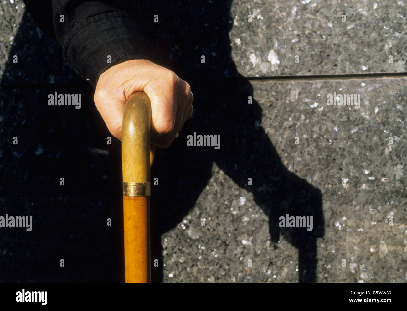 Shadow on a wall of elderly man with cane or walking stick Stock Photo ...