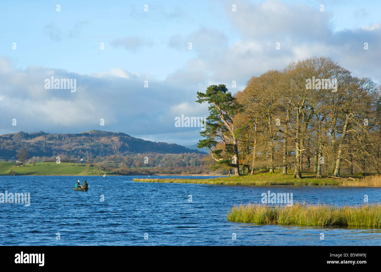 Two anglers fishing from dinghy, Esthwaite Water, near Hawkshead, Lake ...