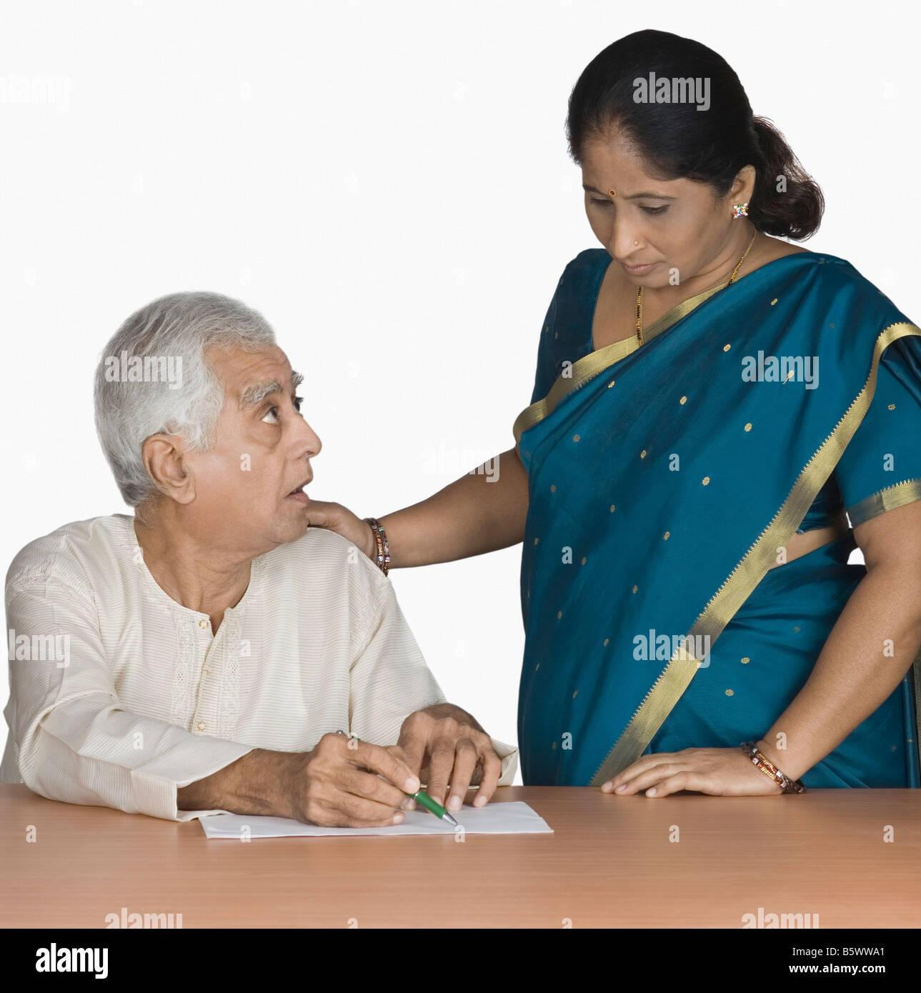 Senior man discussing with his wife Stock Photo - Alamy
