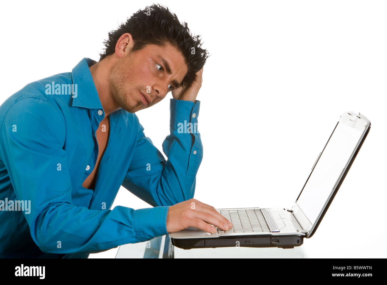 Attractive young man waiting for a slow computer connection Stock Photo ...