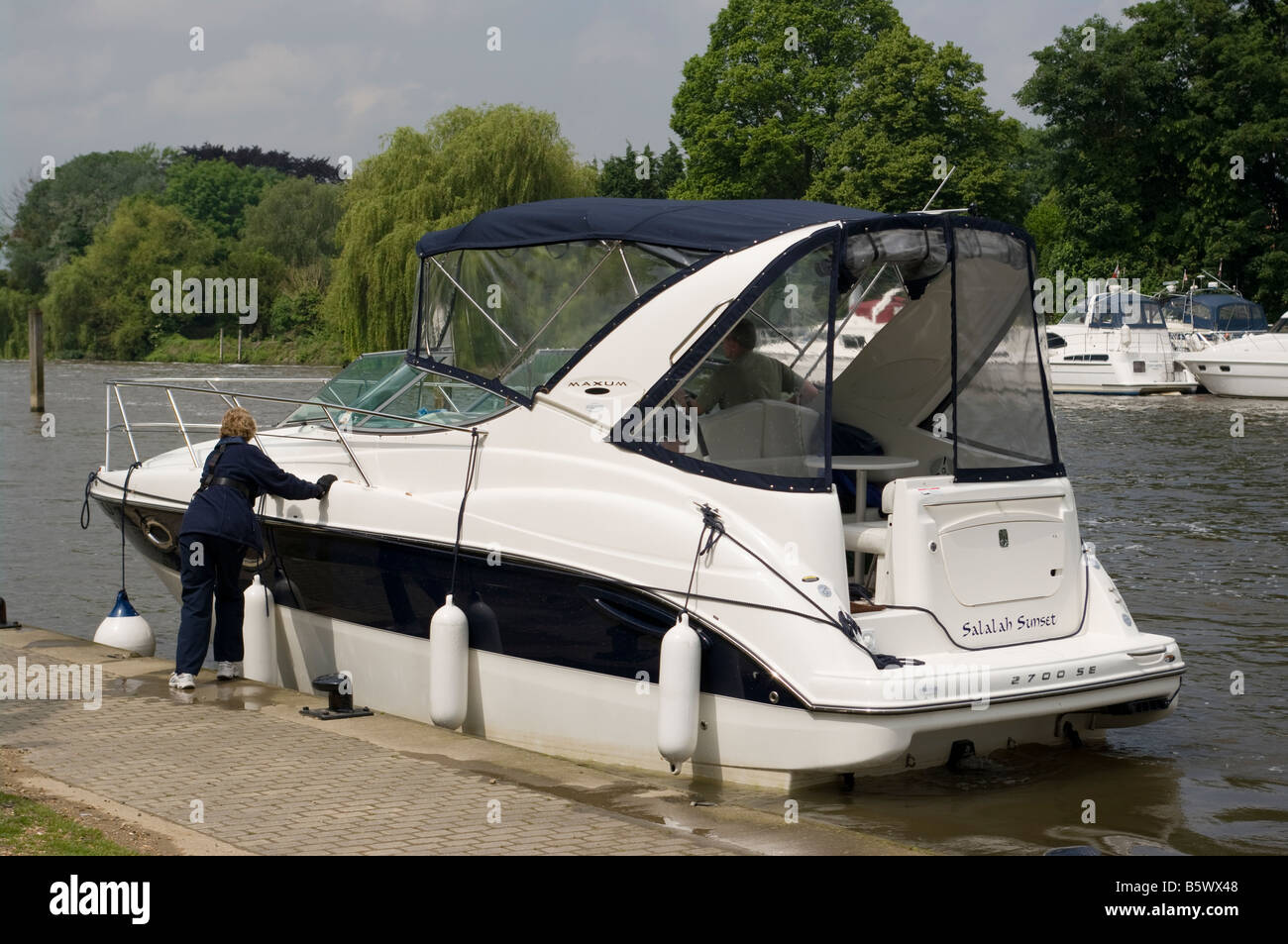 Motor Cruiser Boat Moored at a Mooring on the River Thames at Molesey ...