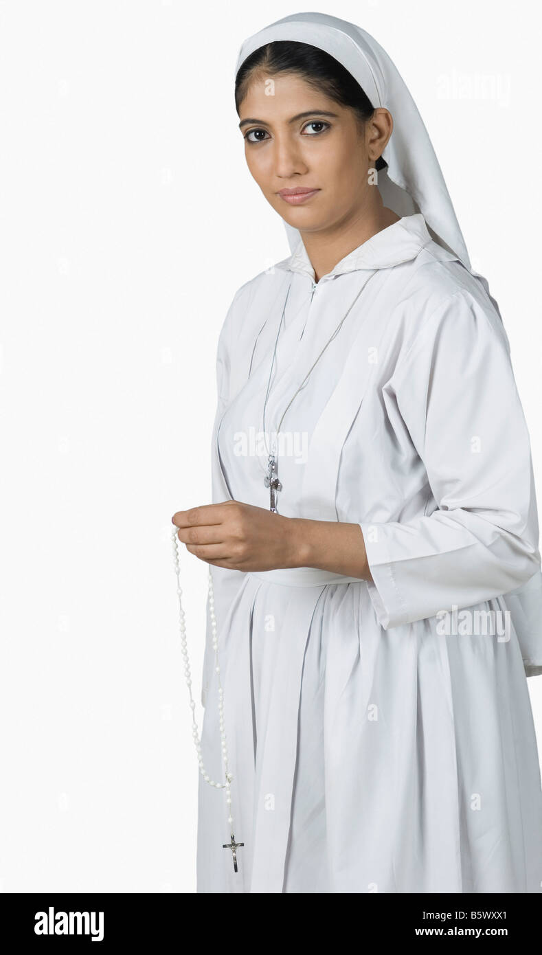 Portrait of a nun holding rosary beads Stock Photo - Alamy