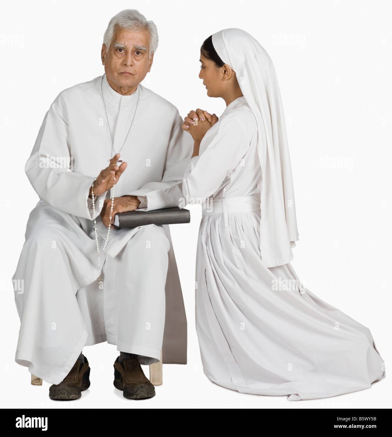 Nun confessing her sins to a priest Stock Photo - Alamy