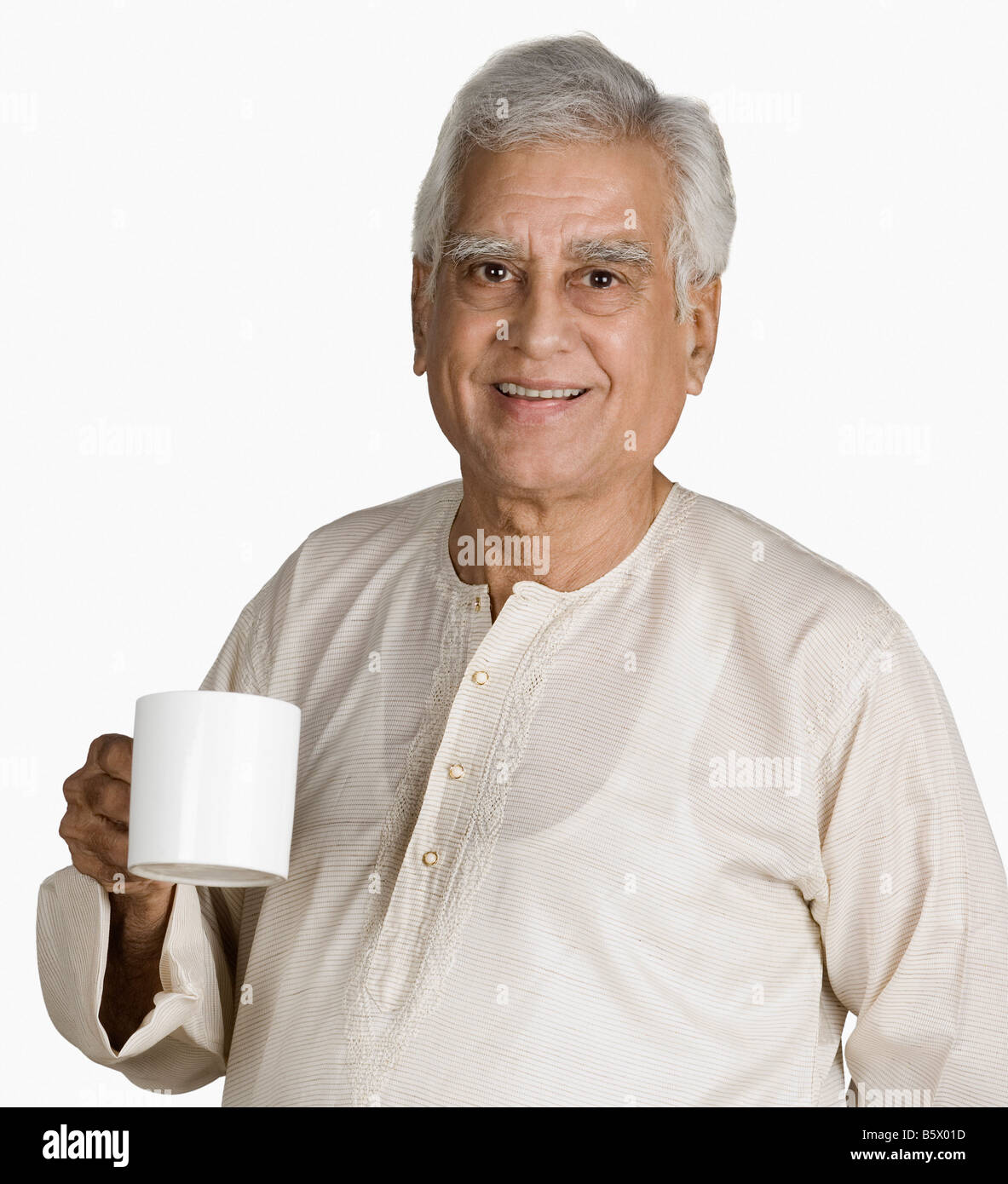 Portrait of a senior man holding a tea cup Stock Photo - Alamy