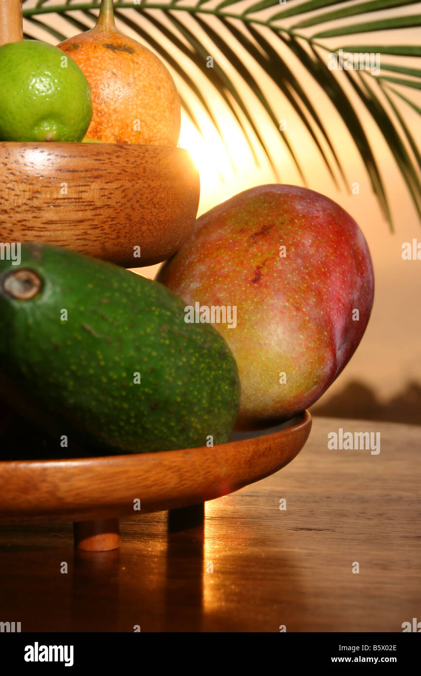 Tropical fruits arrangement infront of the sunset at the beach Sun ...