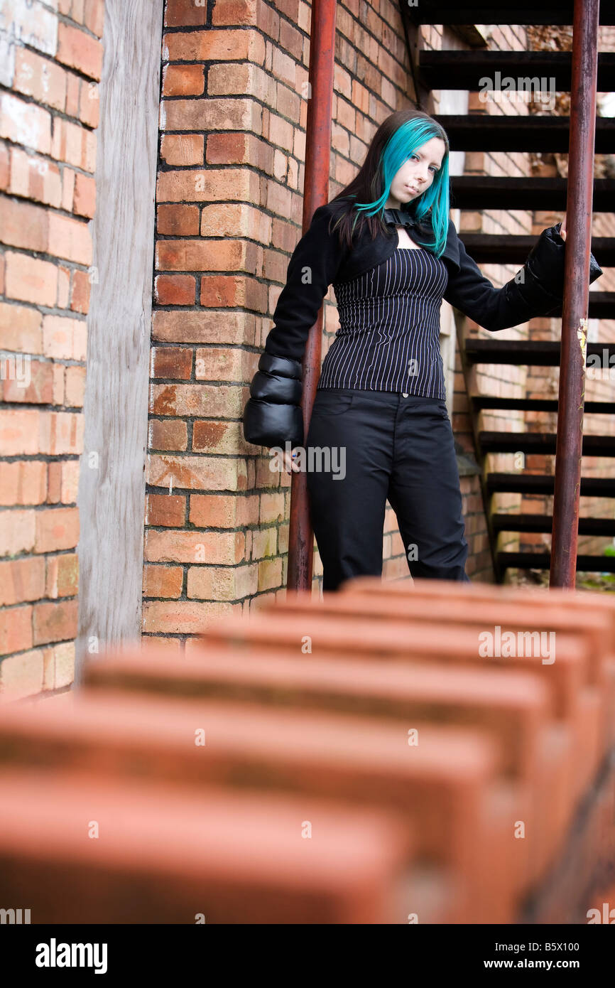 Young teenage gothic girl standing next to building Stock Photo - Alamy