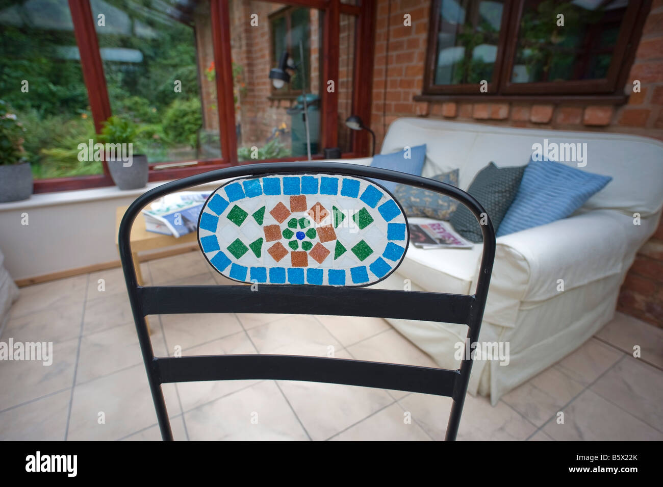 conservatory tables chairs plants room in house next to garden Stock ...