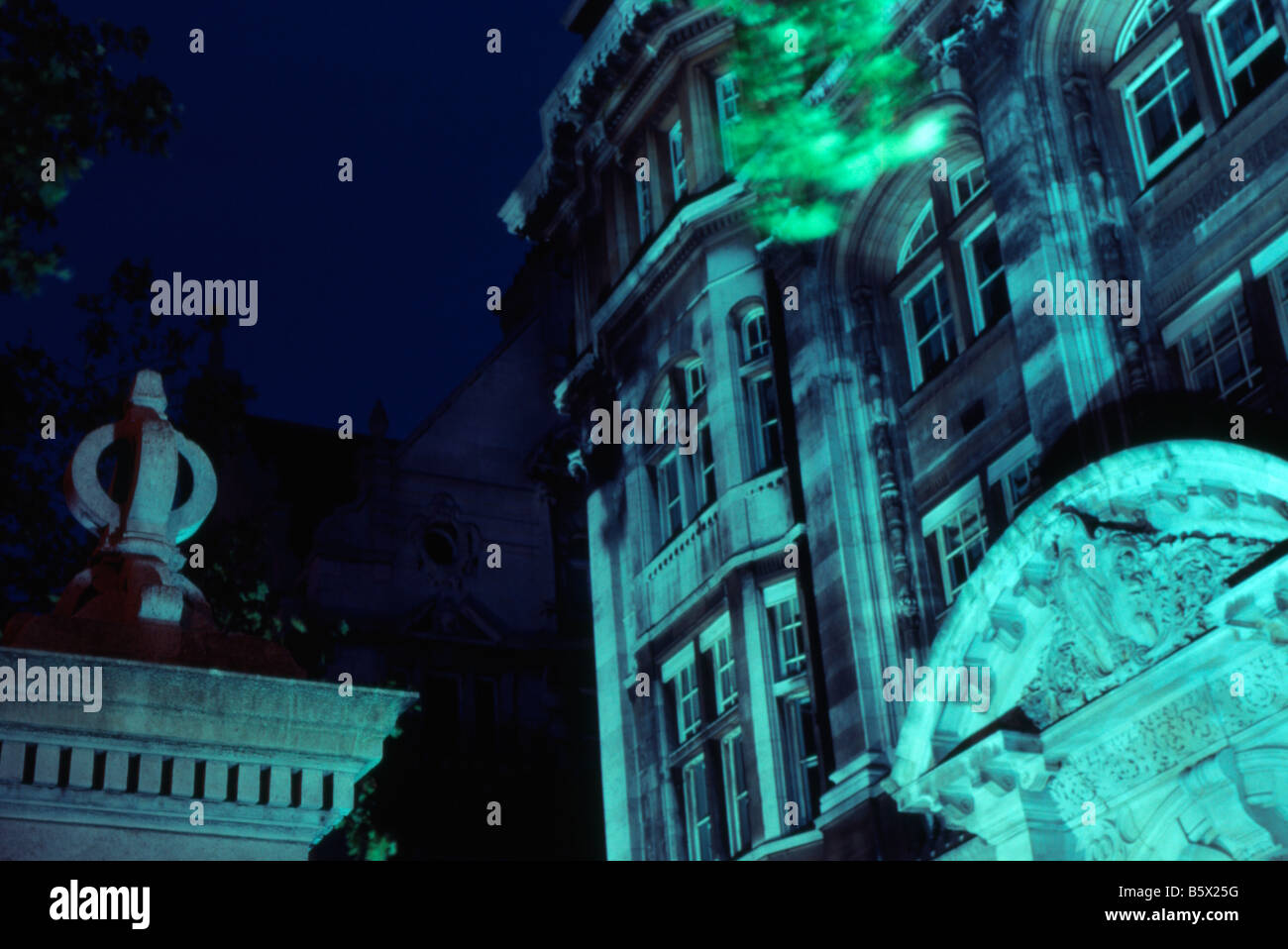 Night lit building in central london with interesting reliefs and ...