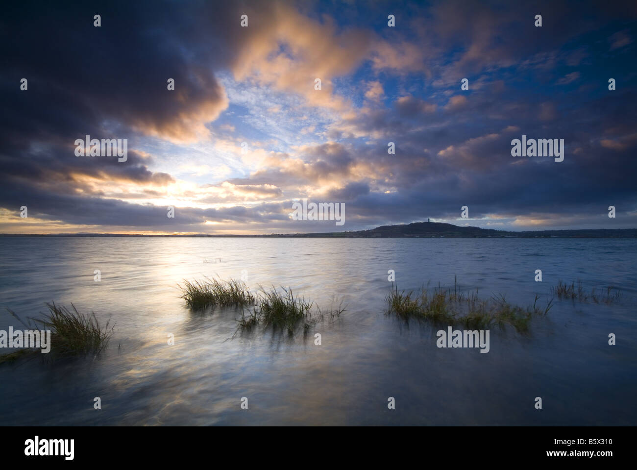 Landscape image of Strangford Lough and scrabo tower under a moody ...