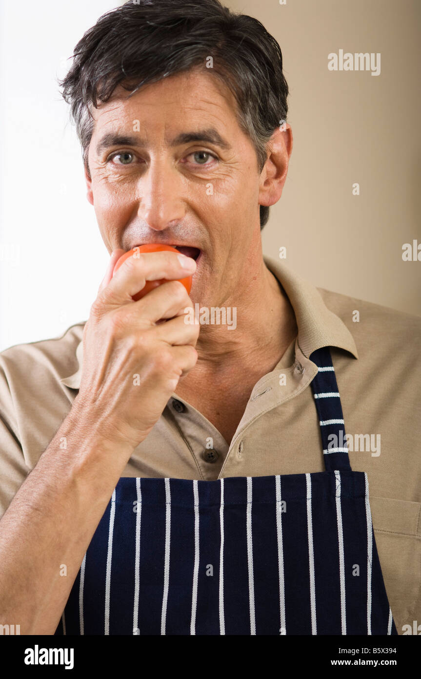 Biting into a tomato hi-res stock photography and images - Alamy