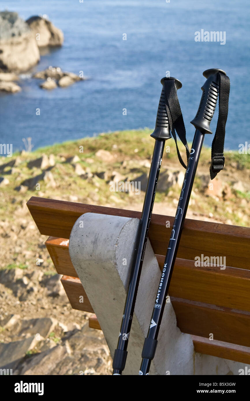 A pair of walking sticks leaning against a bench, UK Stock Photo - Alamy