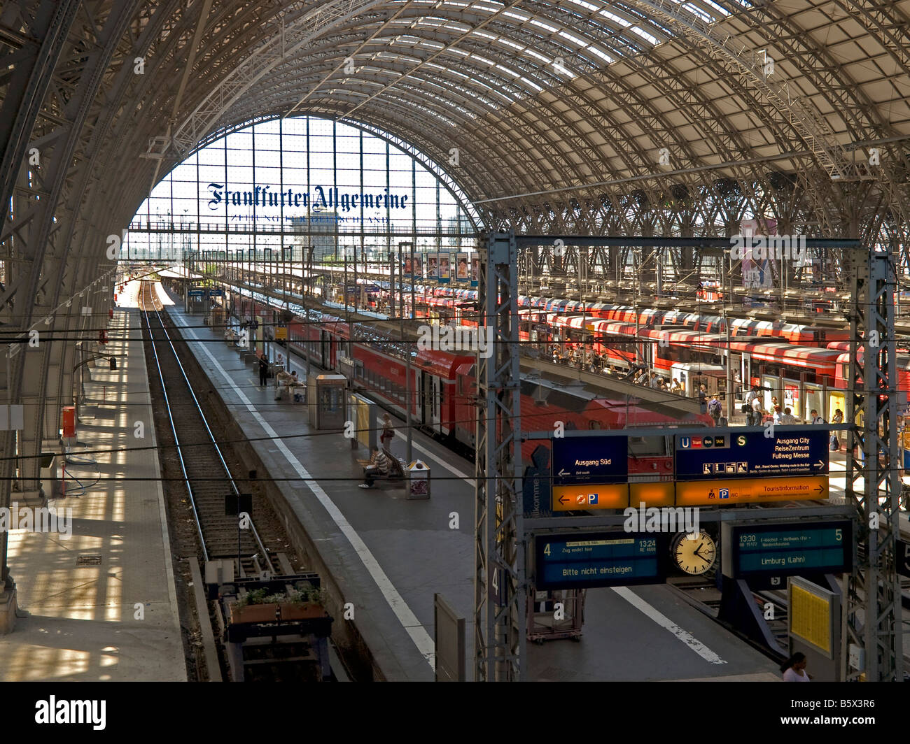 waiting hall with busy passangers sitting to train platform at the main ...