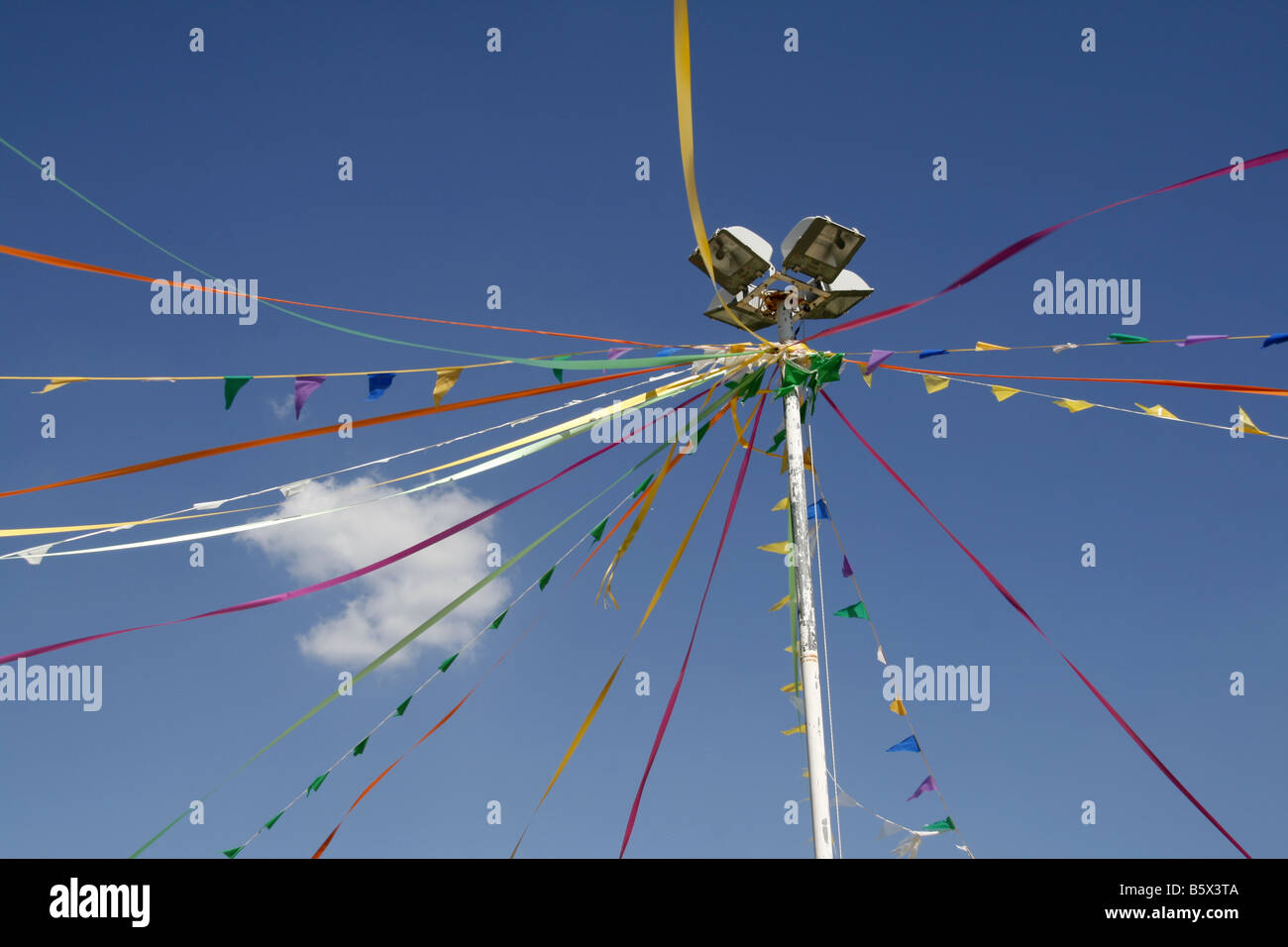 many colourful carnival flags decorations in street party outdoors in ...