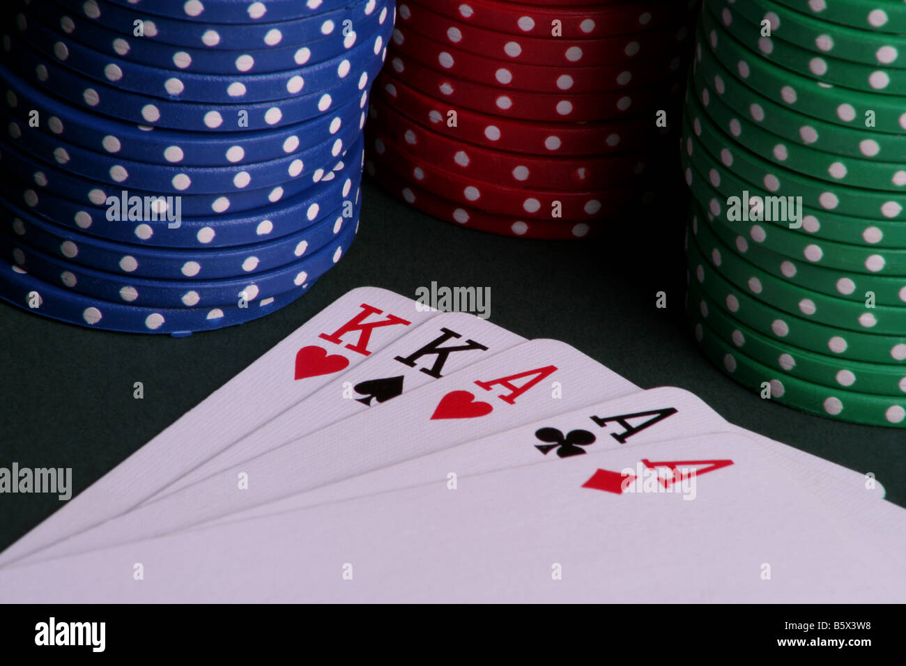 Piles of poker chips and playing cards Stock Photo - Alamy