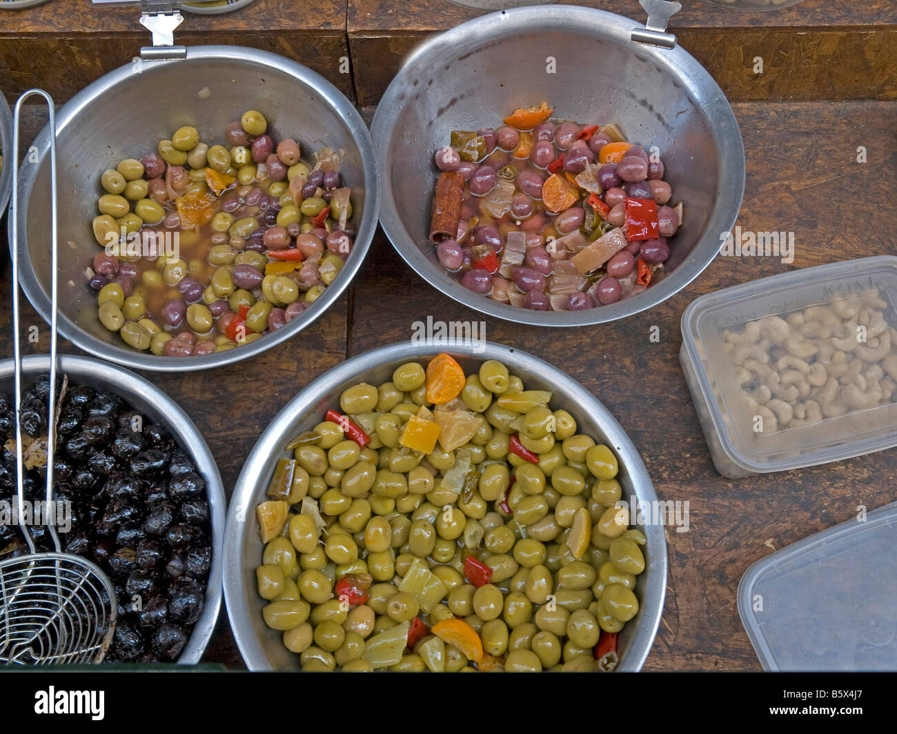 stall on market place pots with different olives and cashews Saint ...