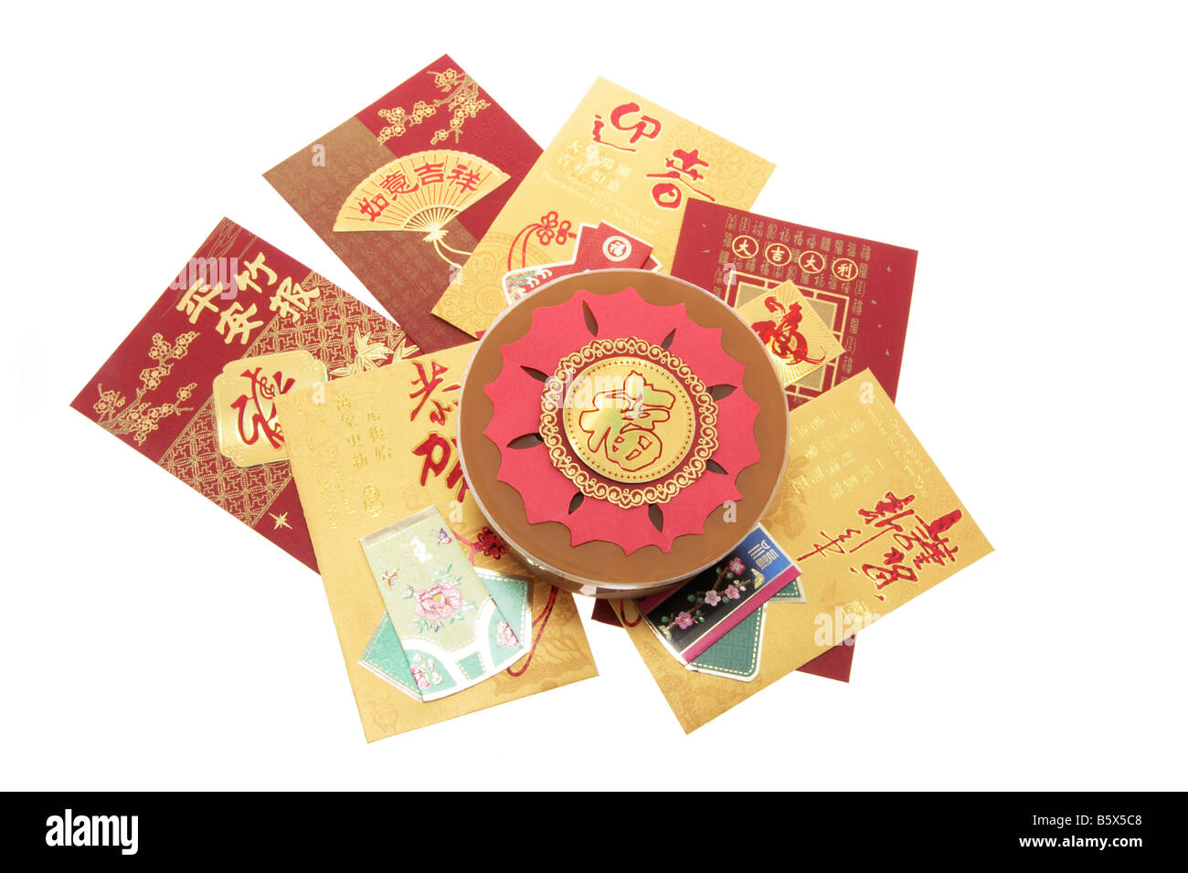 Chinese New Year Cake and Red Packets Stock Photo - Alamy