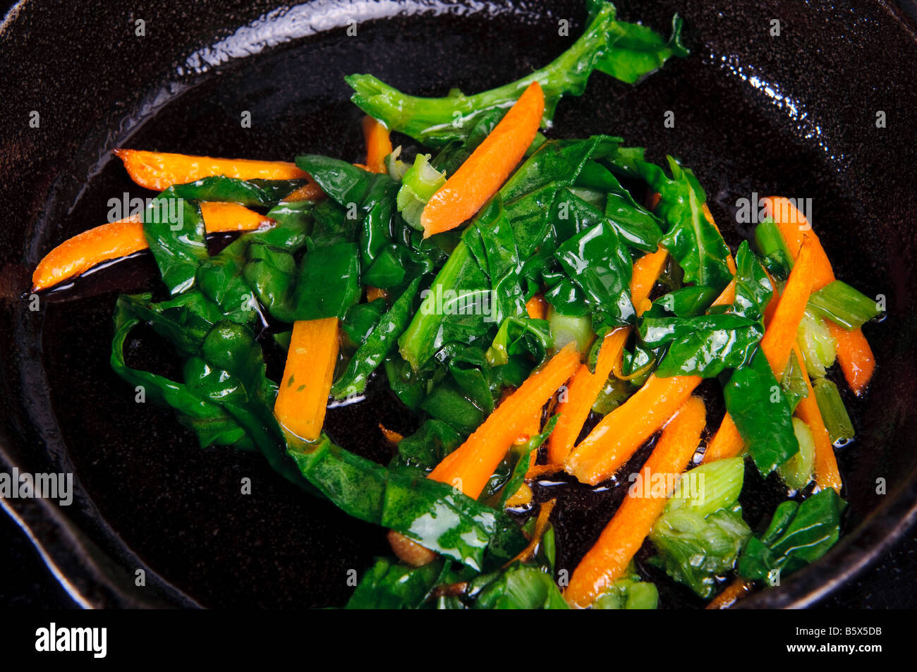 vegetables sauteing in a pan Stock Photo - Alamy