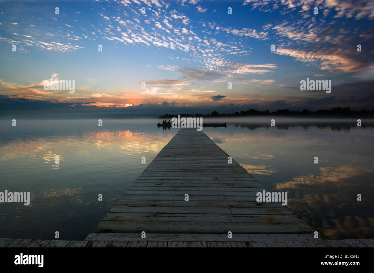 A pier at sunset Stock Photo - Alamy