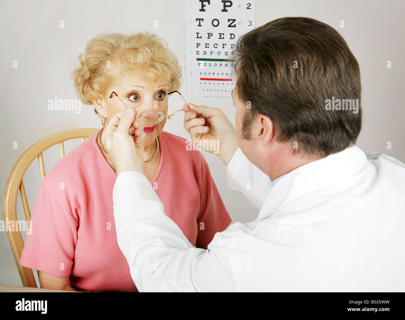 Senior woman trying out a new prescription from her optometrist Stock ...