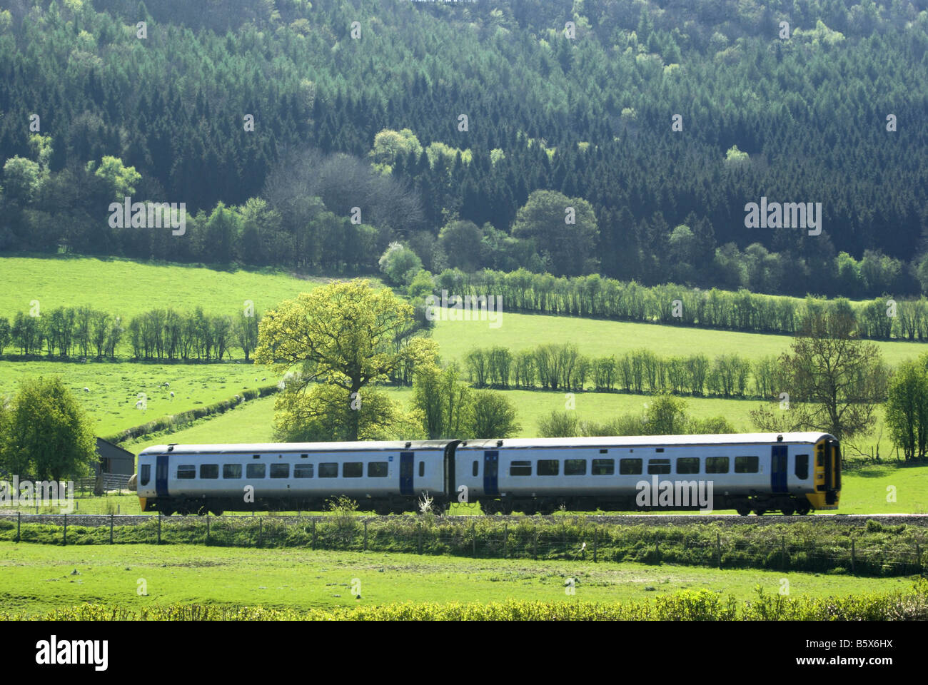 A train on a railway line in the countryside railway; railroad ...