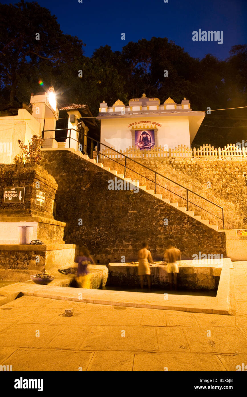 People take an evening bath at the Kadri Manjunatha Temple in Mangalore ...