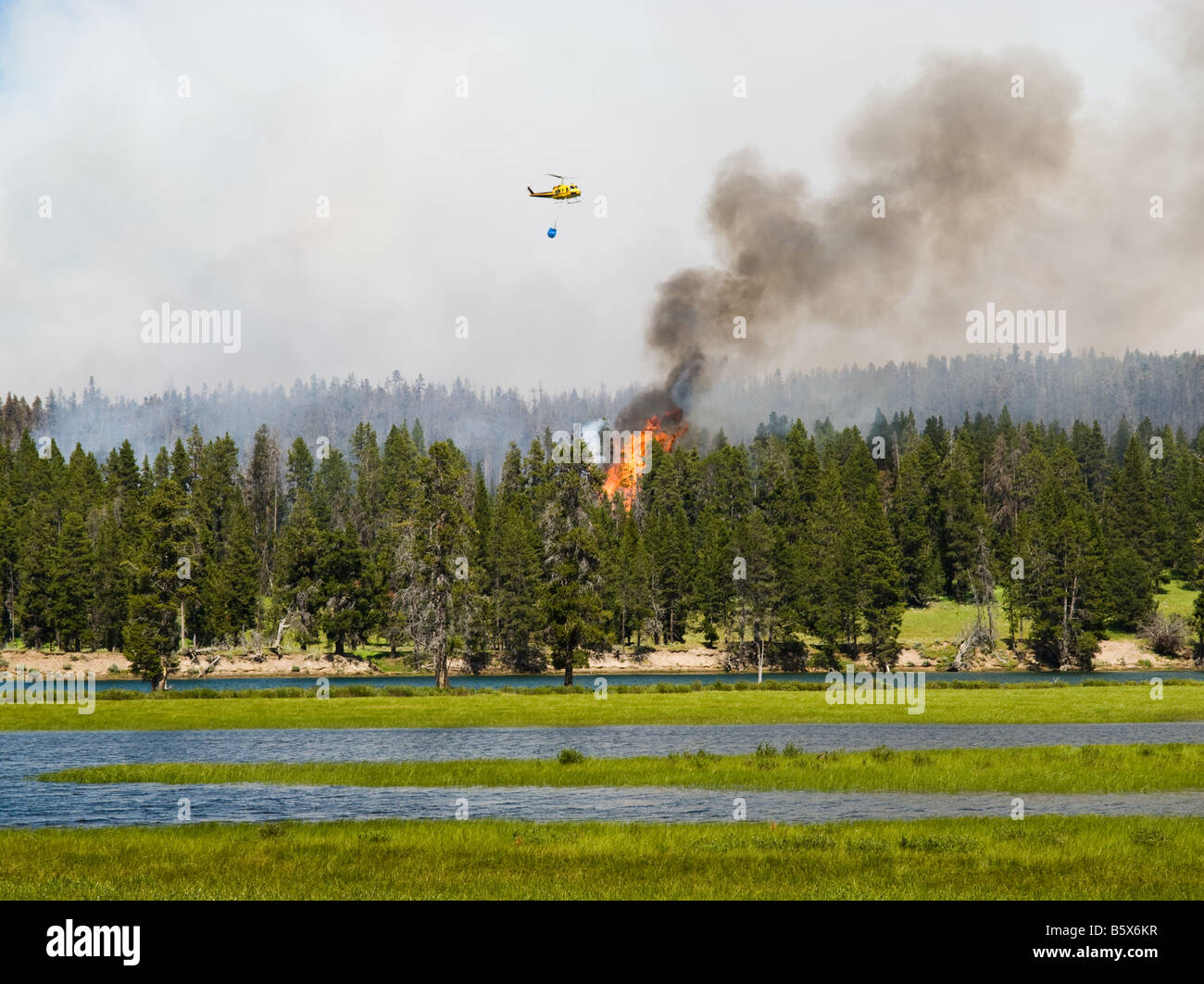 Wildfire drop water bucket flames smoke hi-res stock photography and ...