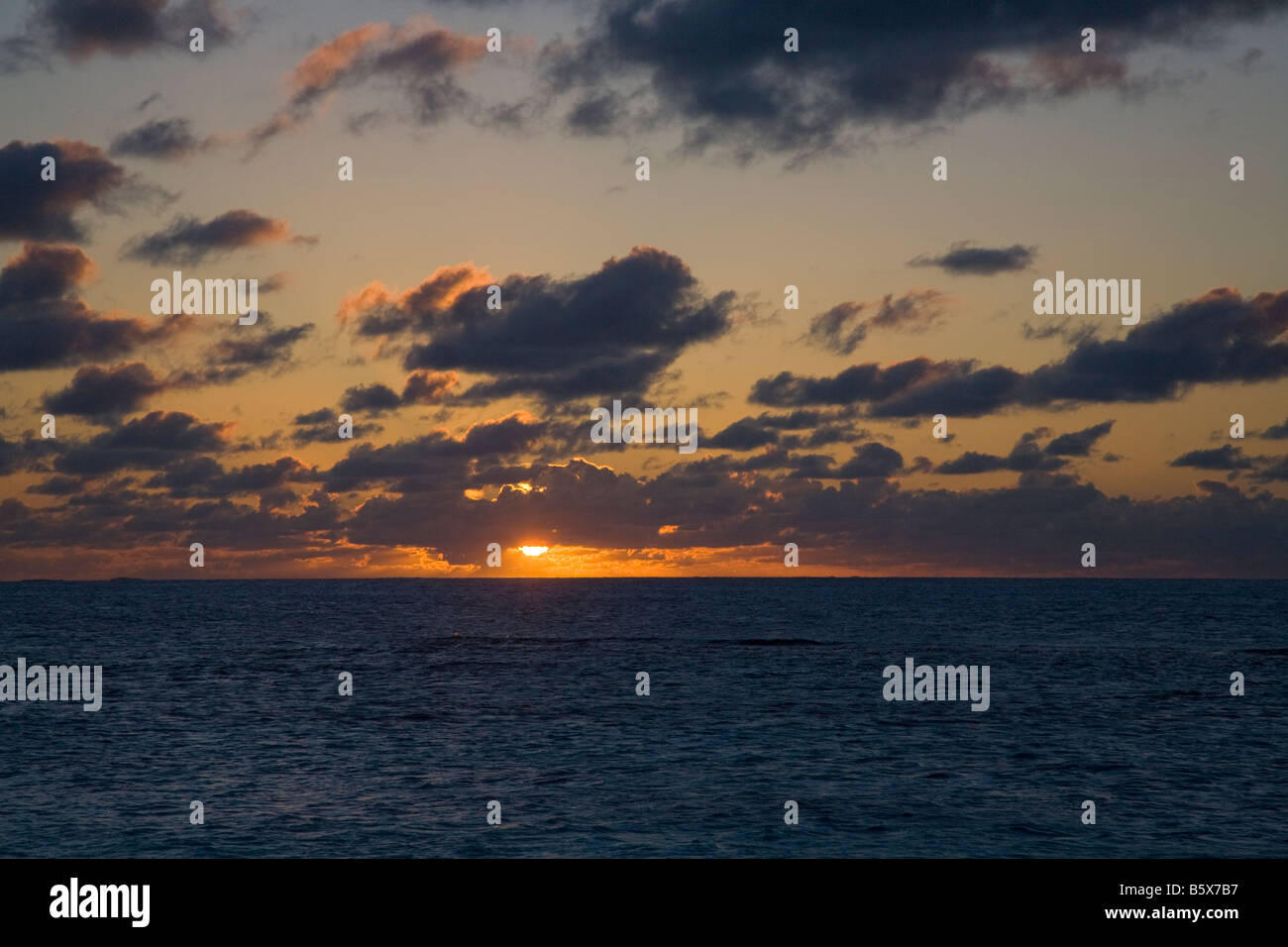 Sunset over Atlantic Ocean from the caribbean island of Anguilla in the ...
