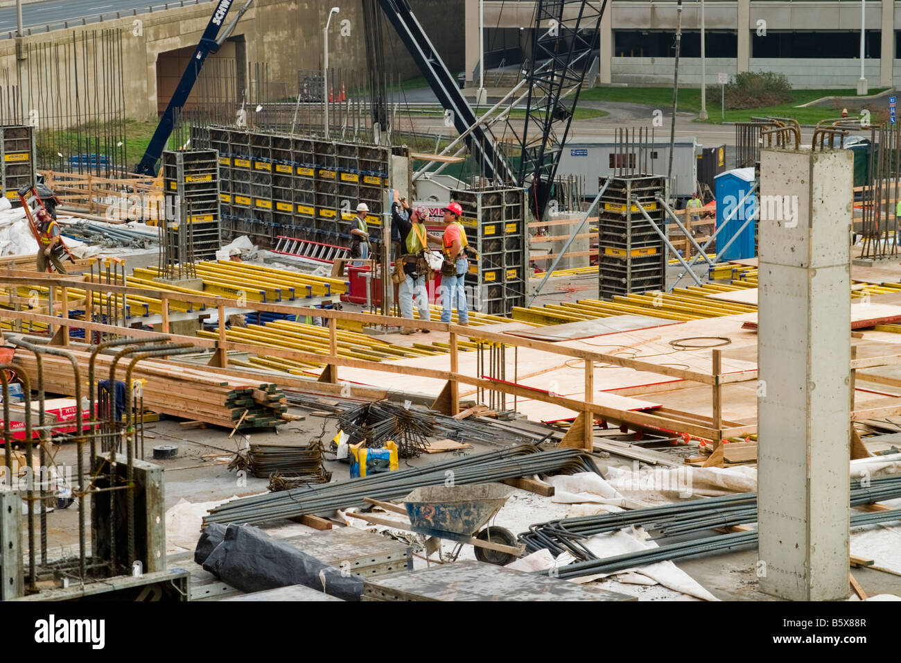 Worker carrying rebar hi-res stock photography and images - Alamy
