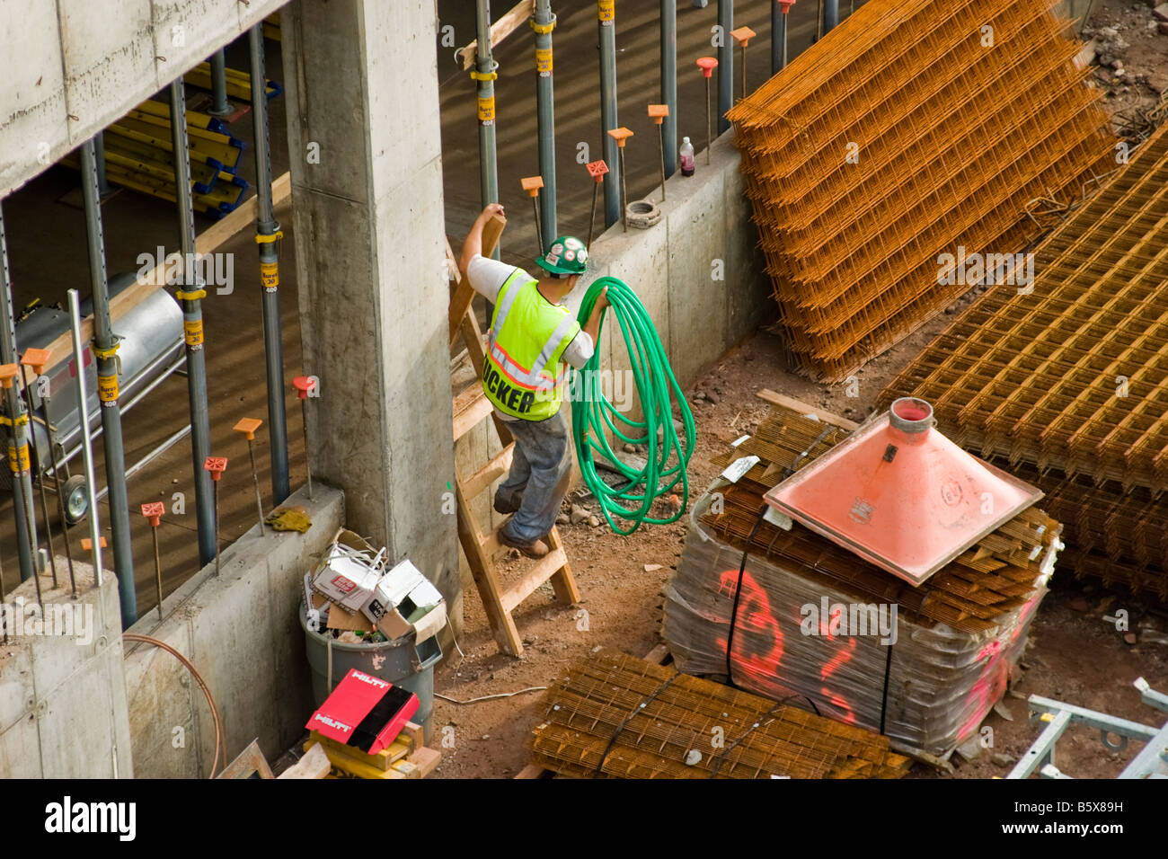Worker at a construction site Stock Photo - Alamy