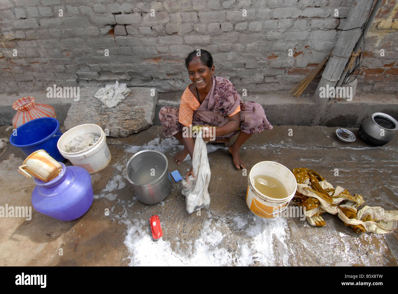 A WOMAN WASHING CLOTHES MADURAI TAMILNADU Stock Photo - Alamy