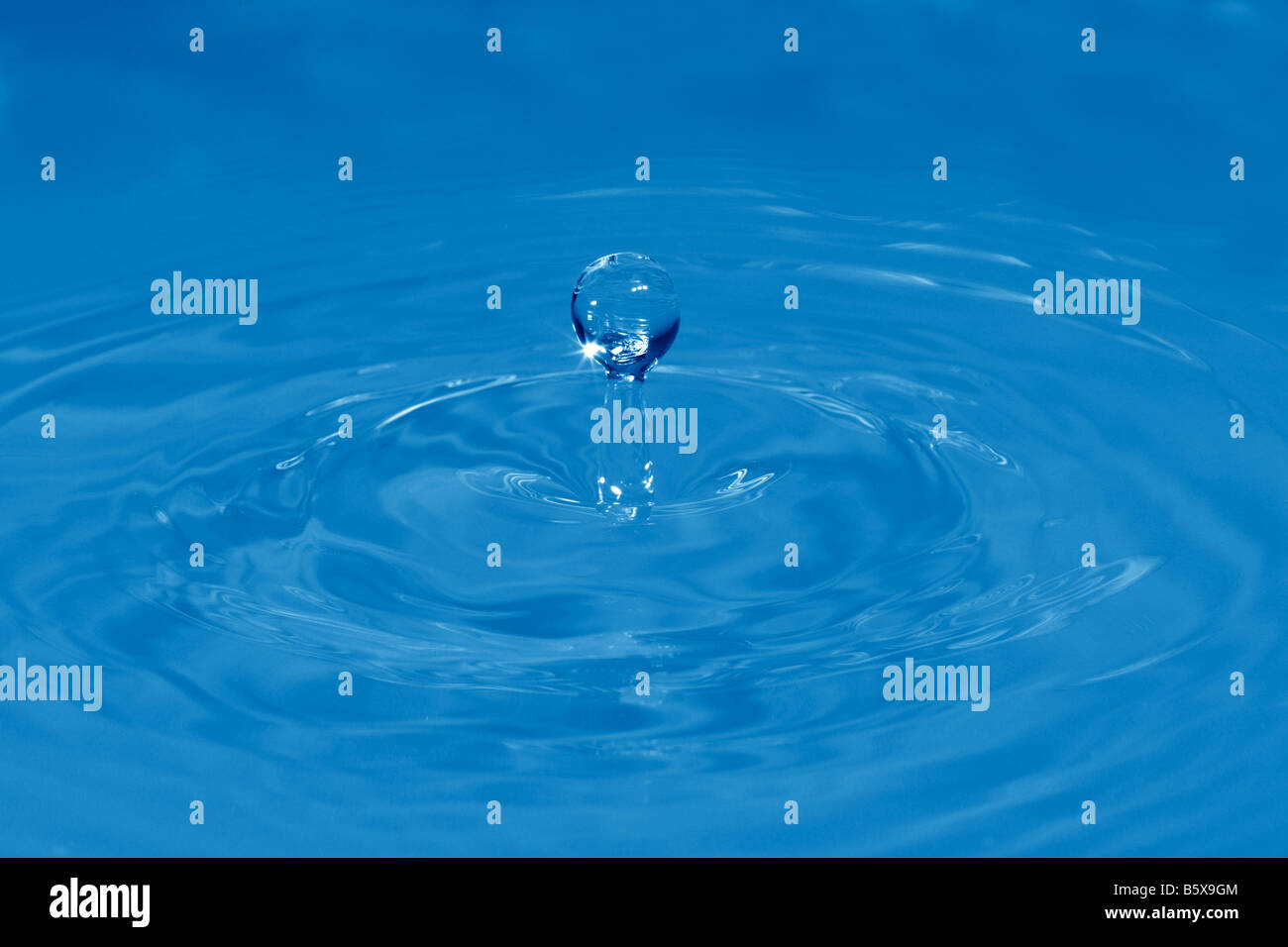Water droplets splashing down Stock Photo - Alamy