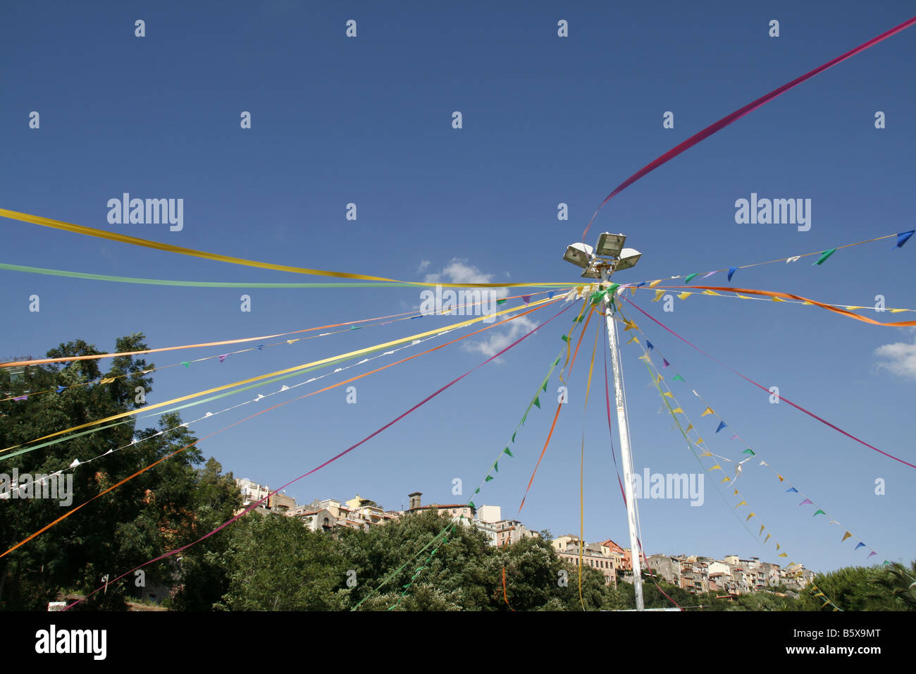 many colourful carnival flags decorations in street party outdoors in ...