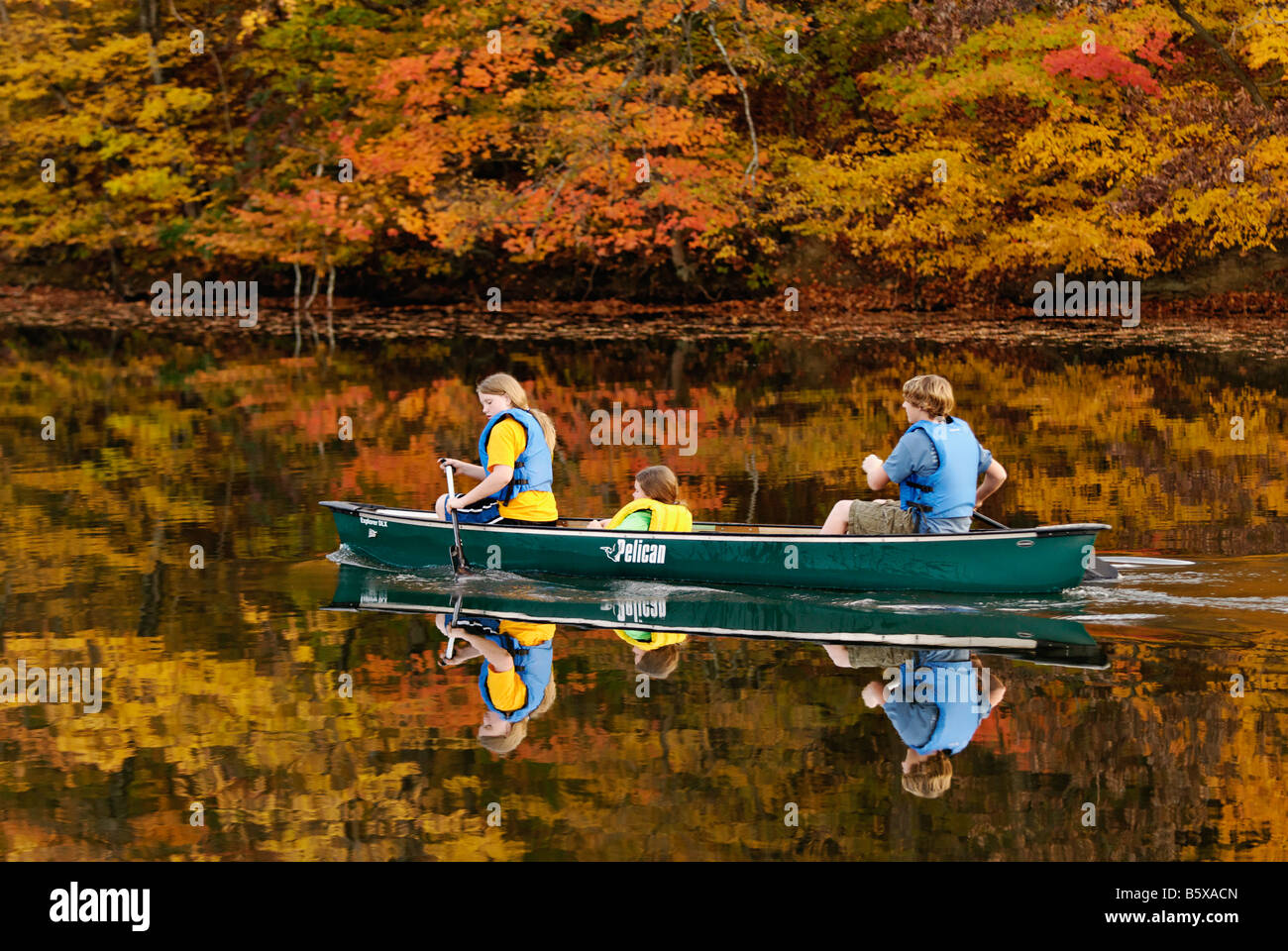 Children Paddling Canoe on Lake with Autumn Reflections Mount Saint ...
