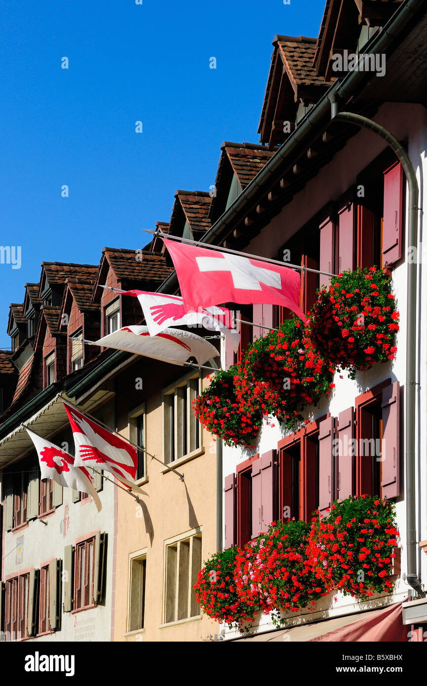 Flags are displayed on the houses in a typical Swiss Town in north ...