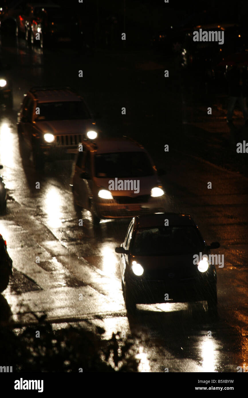 fast car driving in heavy rain at night in town Stock Photo - Alamy