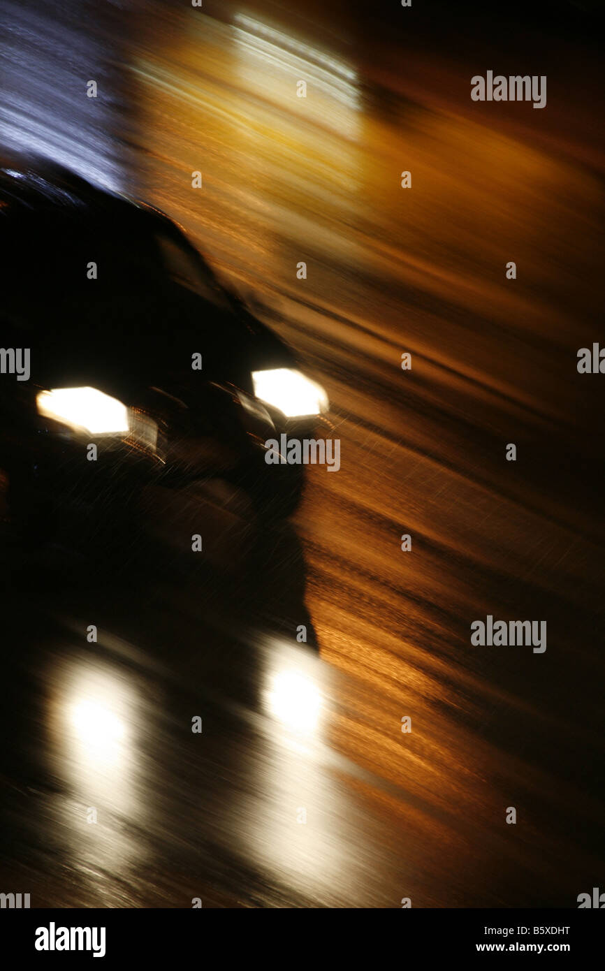 fast car driving in heavy rain at night in town Stock Photo - Alamy