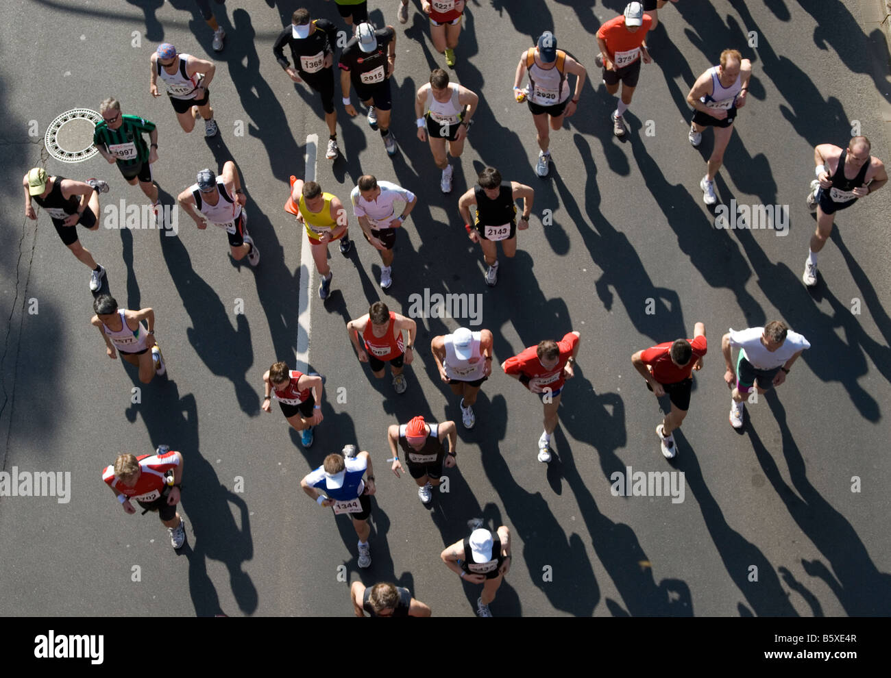 Marathon Runners seen from above Stock Photo - Alamy