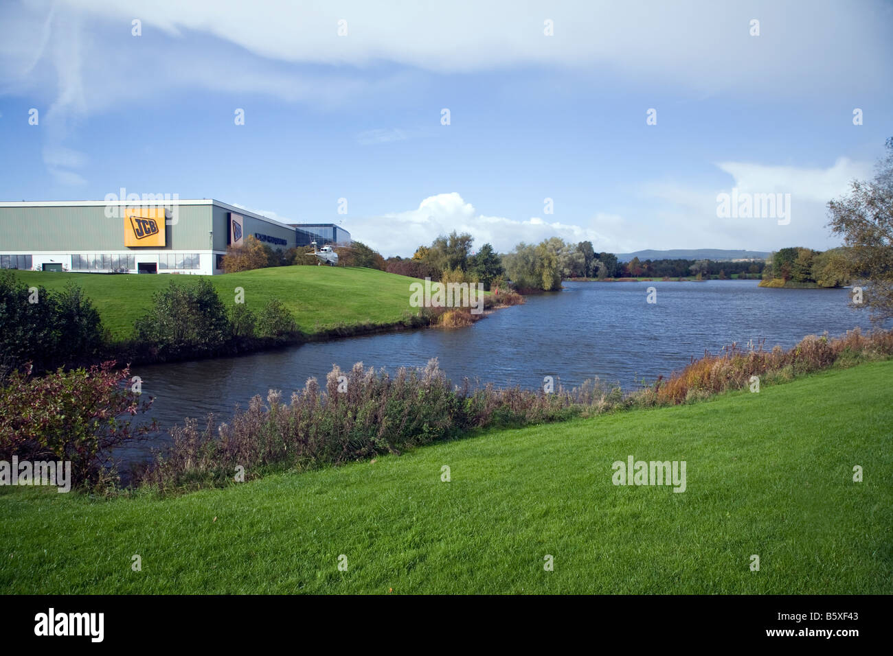 JCB Landscaped grounds with lake at Rocester Stock Photo - Alamy