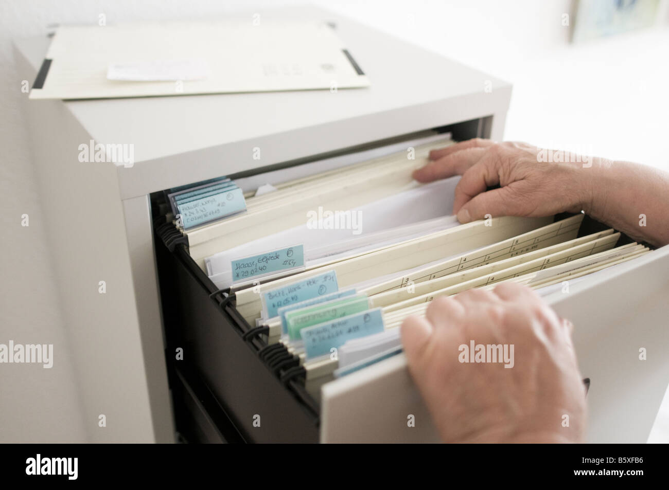 Doctor searching patients files-close-up Stock Photo - Alamy