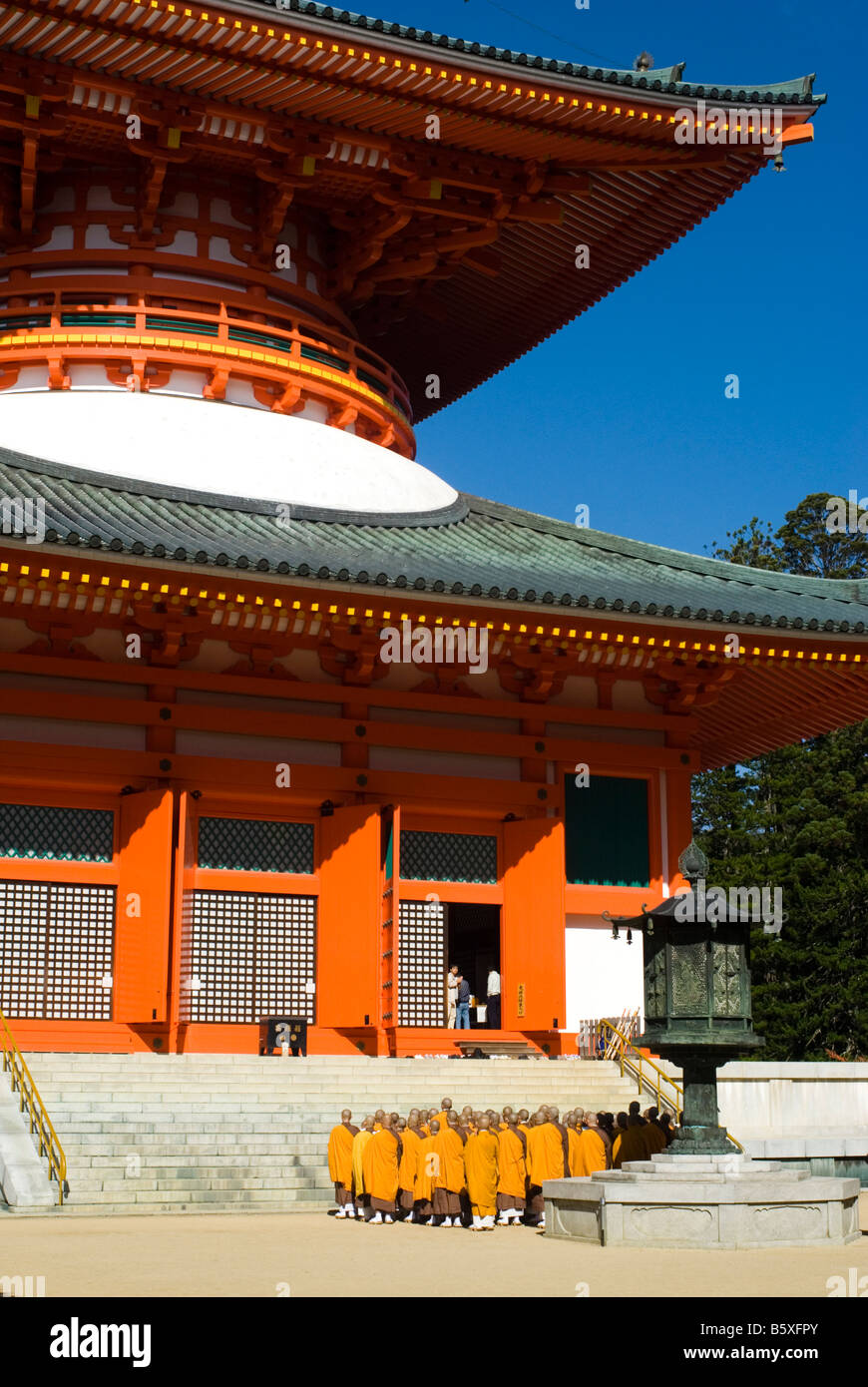 Buddhist shingon monks pray in fornt of Konpon Daito tower in Danjo ...