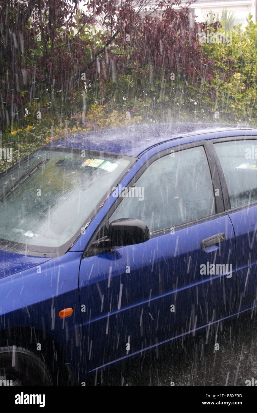 Heavy rain outside a house in Ireland blue car in the driveway Stock ...