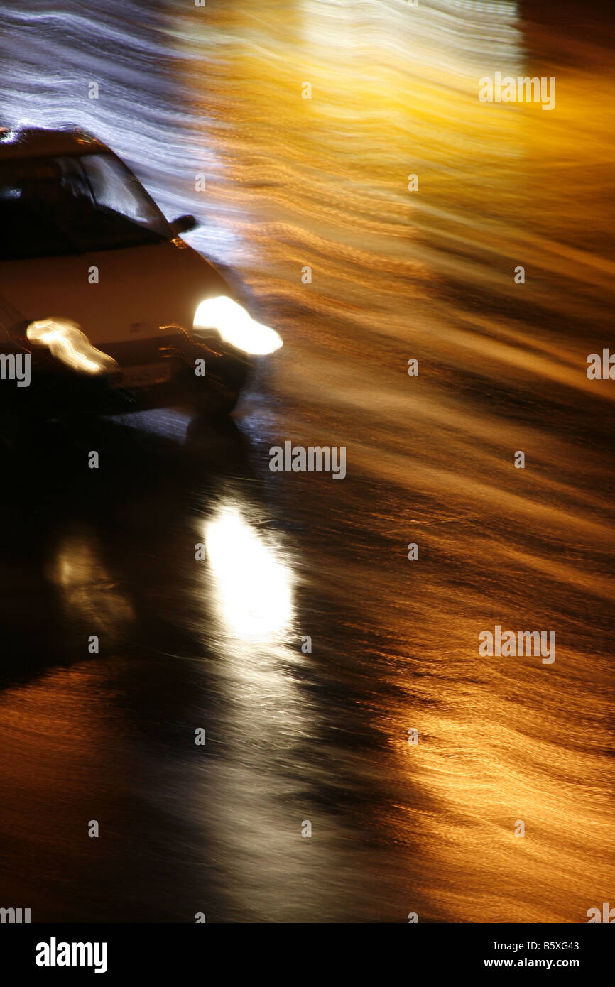 fast car driving in heavy rain at night in town Stock Photo - Alamy