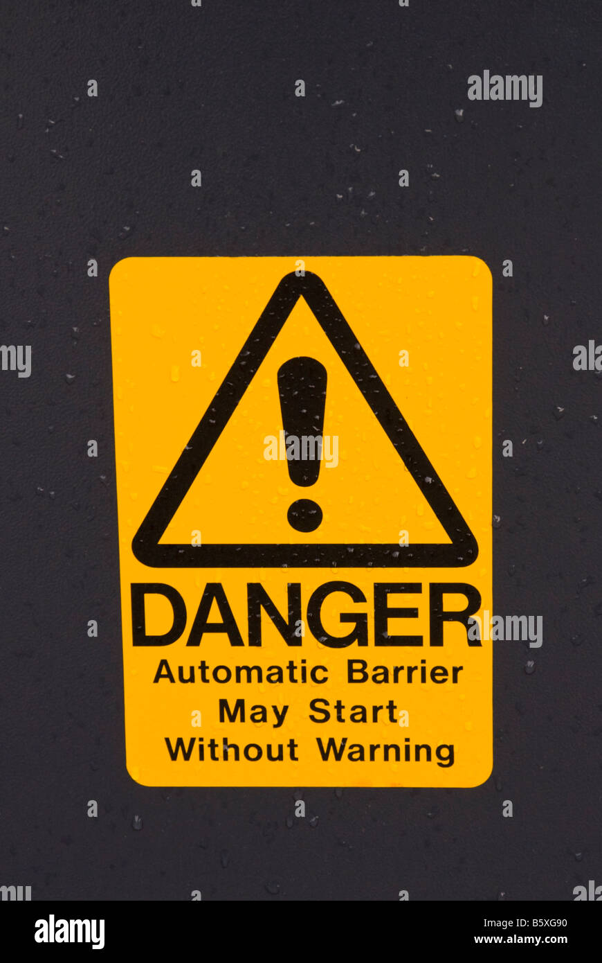 Danger sign stating that Automatic Barrier May Start Without Warning in ...