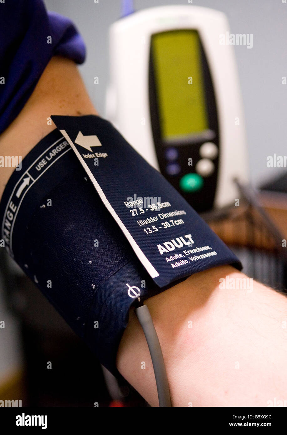 A patient has blood pressure taken at an NHS hospital in UK Stock Photo ...