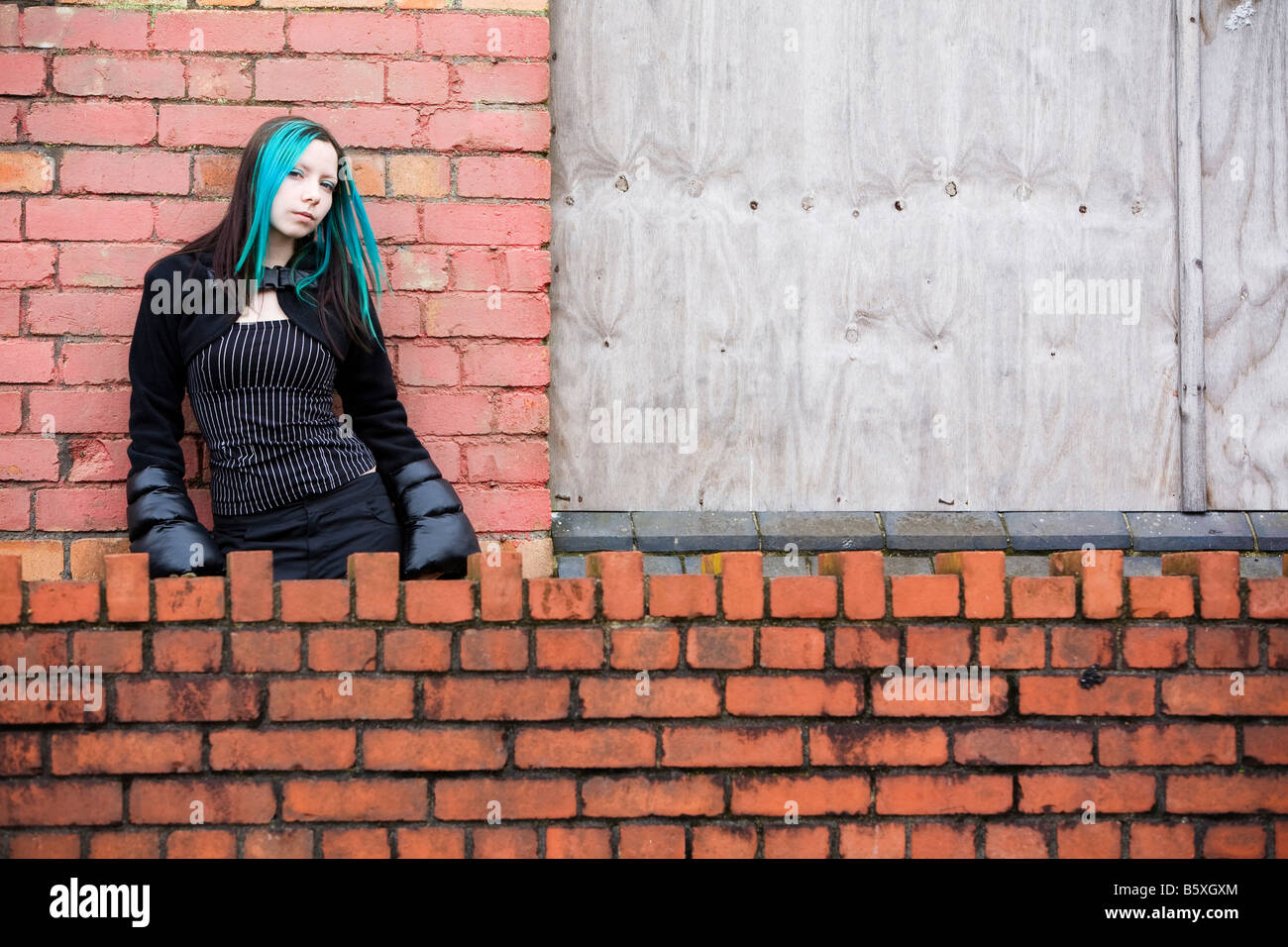 Young teenage gothic girl standing next to a derelict building Stock ...