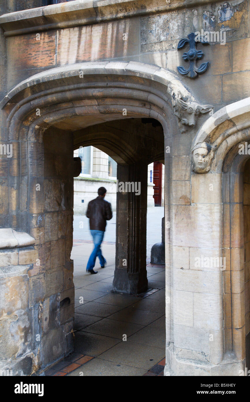 Man walking past building hi-res stock photography and images - Alamy